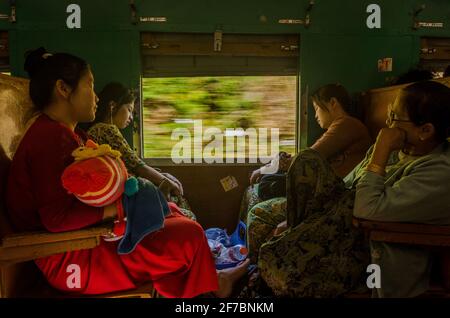 Passenger on a train from Yangon to Bago Stock Photo - Alamy