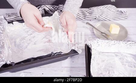 Step by step. Greasing baking pan to make homemade fudge Stock Photo ...