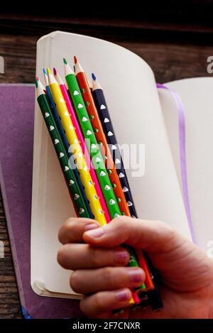 Wooden colorful pencils on a old wooden background Stock Photo - Alamy