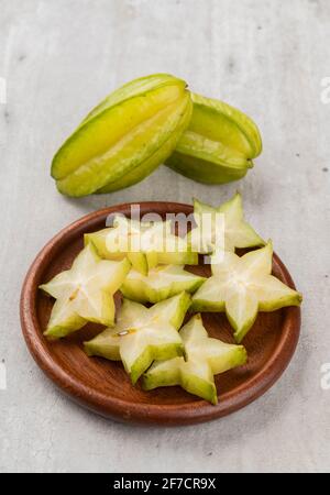 Plate of Juicy Fresh Ripe Starfruit's Cross Sections with Whole Fruit ...