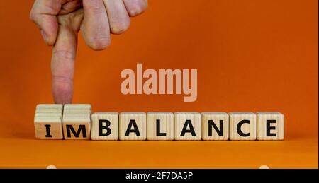 Balance or imbalance symbol. Businessman turns cubes and changes the ...