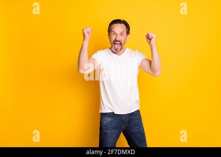 Photo of cheerful crazy guy shout raise palms wear christmas sweater ...