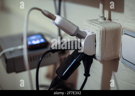 On fire adapter charger mobile at plug Receptacle on black background ...
