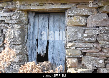 Old stone built farm shed with an open door Stock Photo - Alamy