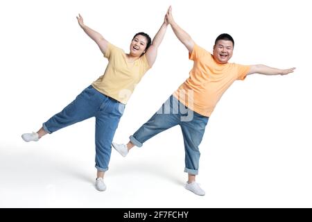 Happy young Chinese couple playing basketball outdoors Stock Photo - Alamy
