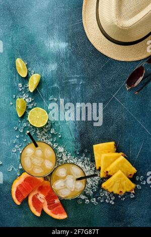 Straw hat and exotic tropical fruits top view. Vacation and diet ...