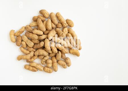 Unshelled peanuts top view isolated on white background raw in the ...