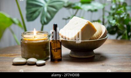 Beautiful composition with spa stones and candle on table on dark ...