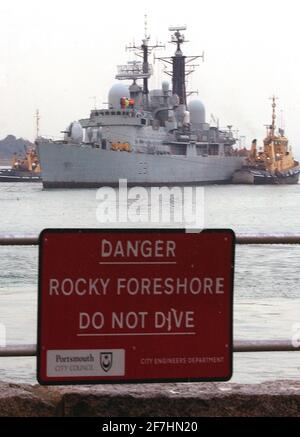 HMS NOTTINGHAM , BACK IN THE WATER, IS TOWED INTO PORTSMOUTH NAVAL BASE ...