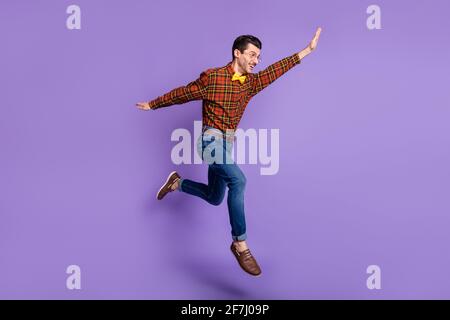 Profile photo of guy jump raise hand look empty space wear beige ...