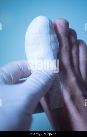 Foot big toe bandage injured feet in medical clinic hospital center ...