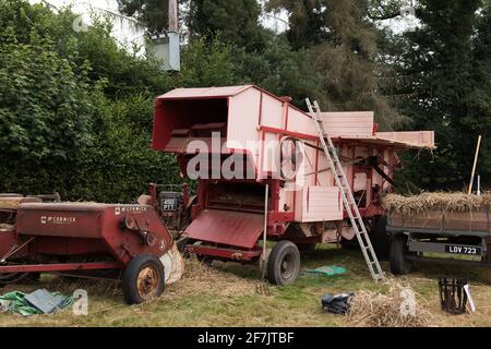 An antique hay baler Stock Photo - Alamy