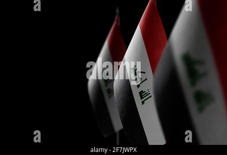 Small national flags of the Iraq on a black background Stock Photo - Alamy