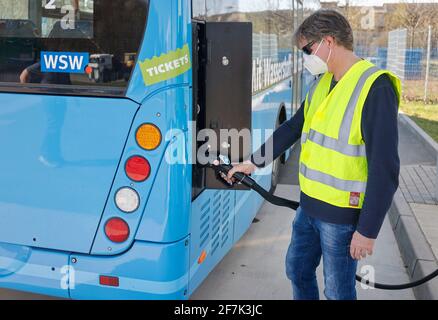 Hydrogen bus refuelling station. The pump dispenses hydrogen fuel for ...