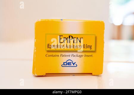 Close-up of a yellow 'EpiPen' branded epinephrine autoinjector box end ...