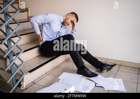 Fall And Fall Injury Accident At Workplace. Man Fell Down Stairs Stock ...
