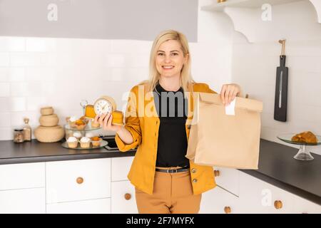 Happy Woman Unpacking On Line Purchase At Home Stock Photo - Alamy