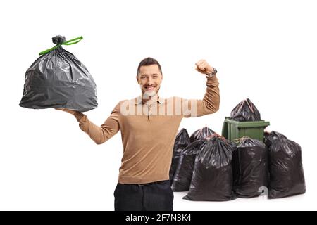 Young man throwing garbage in trash bin on white background Stock Photo ...