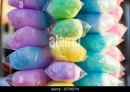 Cotton candy in pink, blue and purple colors isolated on a white ...