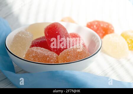 Multi-colored marmalade on the table. Jelly candy with sugar on top ...