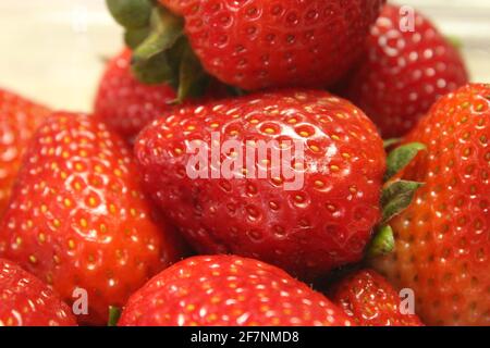 A group of strawberries on display Stock Photo - Alamy