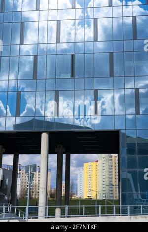 Architectural detail of the facade with multiple reflections of other ...