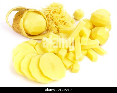 Raw peeled and sliced potatoes in glass bowls on color wooden ...