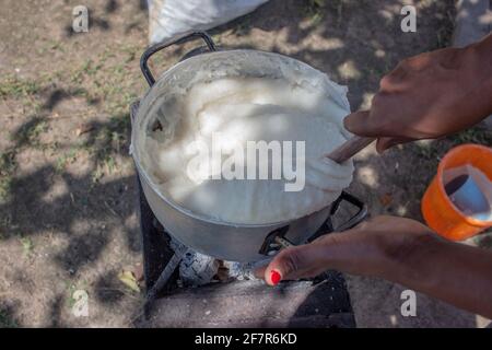 Traditional South African staple, pap or maize meal. Plain in an ...