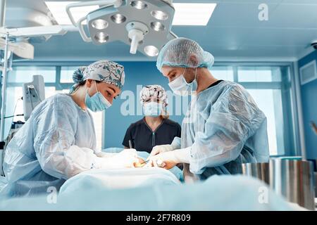 Close up of female belly with suture line after tummy tuck surgery and ...