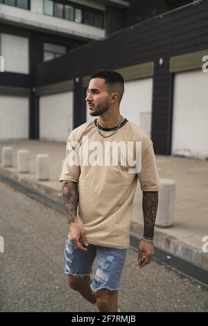 Vertical shot of a handsome Spanish male posing outdoors Stock Photo ...