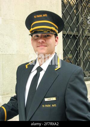 Security man or doorman concierge at entrance to Dakota Building by ...