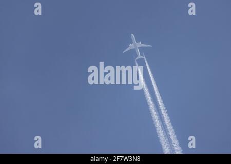 Low angle view of flight departure of jet plane in cloudy sky Stock ...