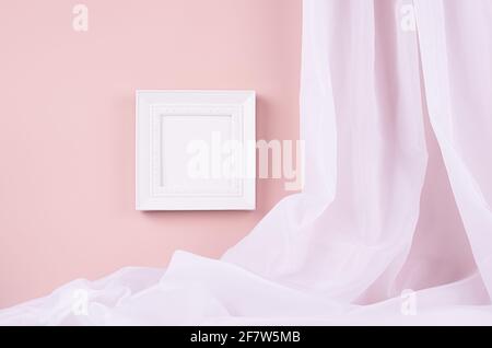 Shelf with decor and pictures hanging on light wall Stock Photo - Alamy