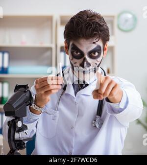 The scary monster doctor working in lab Stock Photo - Alamy