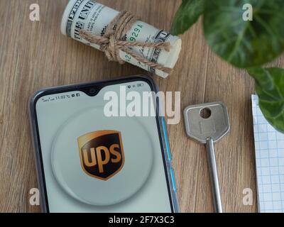 In this photo illustration, the United Parcel Service, Inc. (UPS) logo ...