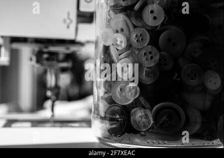 various types of buttons stored in a glass container Stock Photo - Alamy