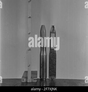 A complete 20 mm grenade with a cross-sectional view of the pushing and ...