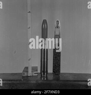 A complete 20 mm grenade with a cross-sectional view of the pushing and ...