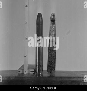A complete 20 mm grenade with a cross-sectional view of the pushing and ...