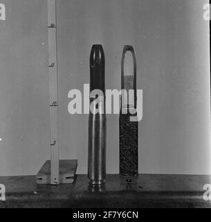 A complete 20 mm grenade with a cross-sectional view of the pushing and ...