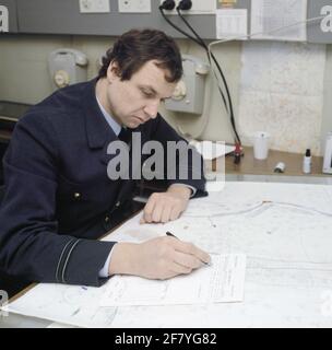 A Meteo officer at work with subscribing to a weather map Stock Photo ...