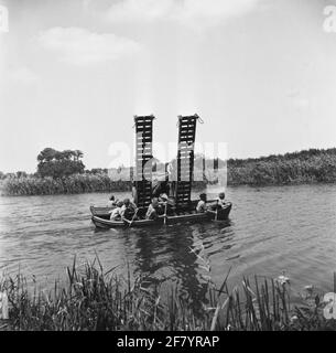 Pontonniers transport a 6-ponder anti-tank guns on a folding boat raft ...