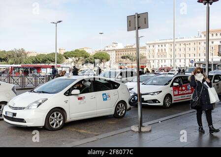 Rome, Italy taxi stand at Termini railway station. White taxis in front ...