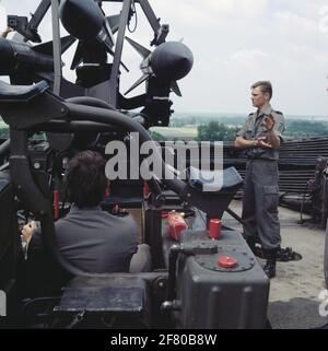 Transferring Hawk missiles to a pallet using the loader transporter ...