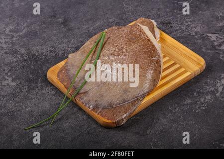 Raw stingray wings tasty fillet for cooking Stock Photo - Alamy