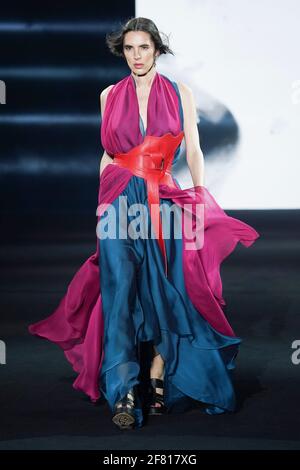 A model walks the runway at the Ulises Merida fashion show during ...