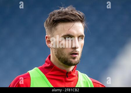 Huddersfield, UK. 10th Apr, 2021. The Huddersfield Town team respect a ...