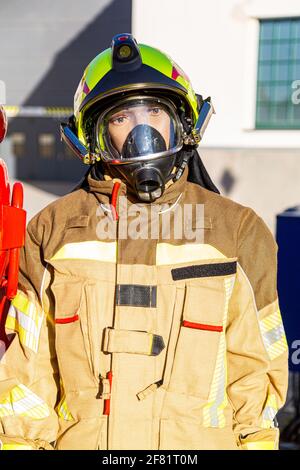 Rescuer wearing uniform and helmet. Professional firefighter Stock ...