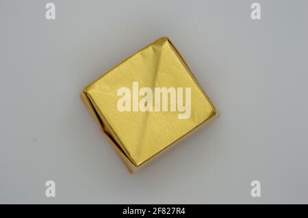 Chocolate candy in foil and form of heart with gifts on wooden ...