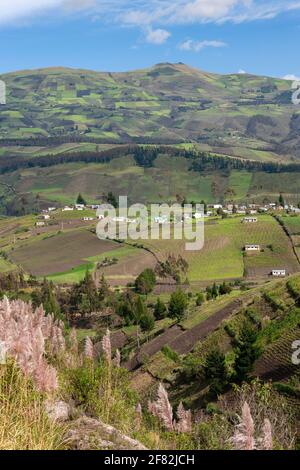A landscape view of the farmland in Ecuador countryside against a blue ...